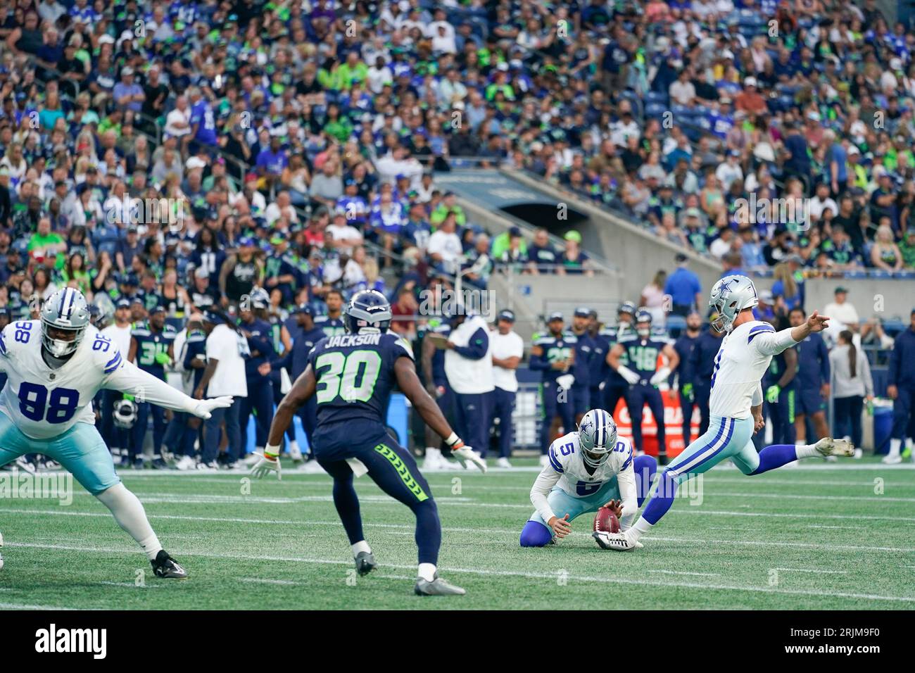 Dallas Cowboys punter Bryan Anger (5) holds the ball for place-kicker ...
