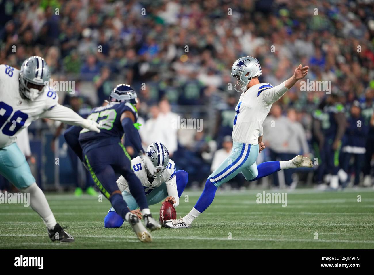 Dallas Cowboys punter Bryan Anger (5) holds the ball as place-kicker ...