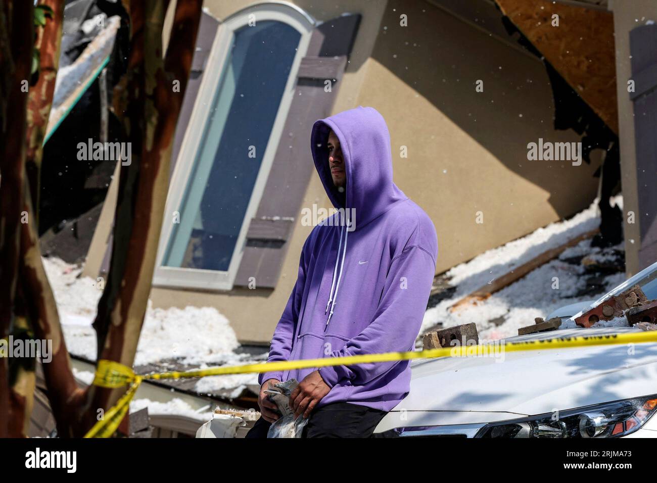 Tennessee Titans cornerback Caleb Farley sits outside of the rubble of ... Tennessee Titans cornerback Caleb Farley sits outside of the rubble of ...