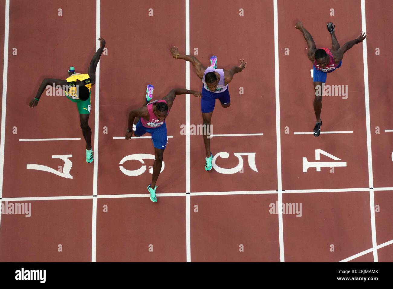 Noah Lyles, of the United States, crosses the finish line first in lane ...