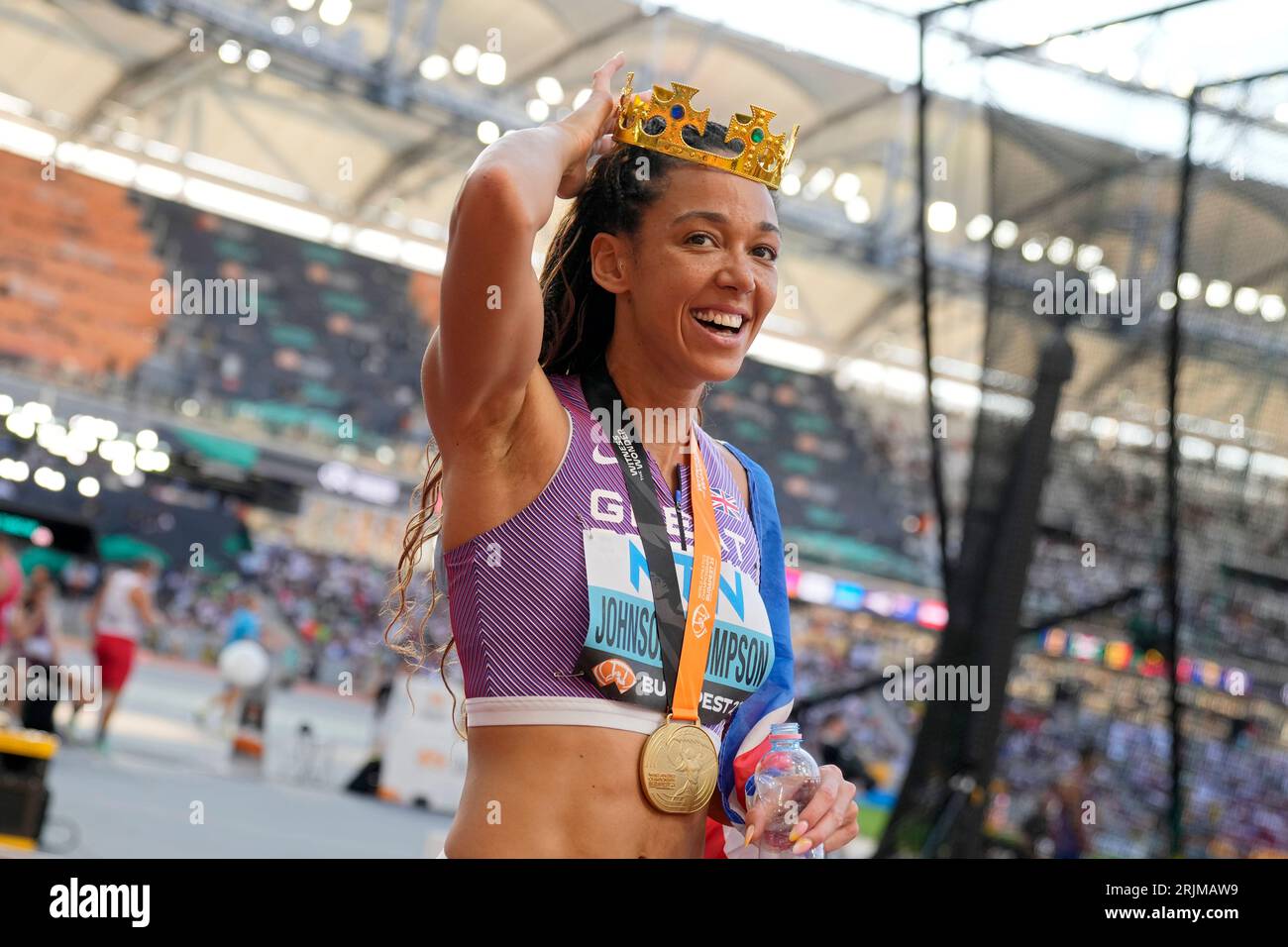 Katarina Johnson-Thompson, of Great Britain, wears a crown as she ...