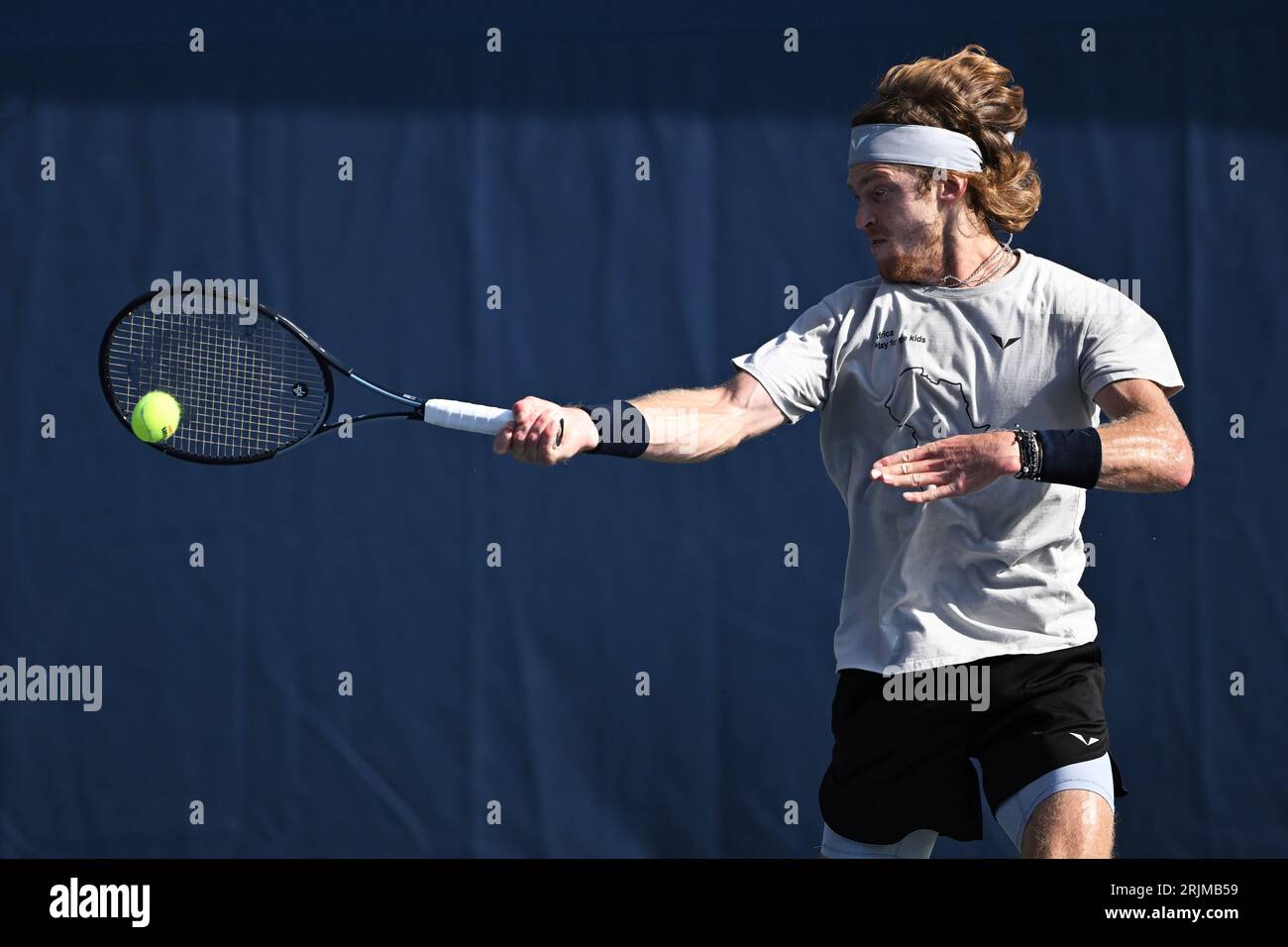 Andrey Rublev hits a forehand during practice at the 2023 US Open ...