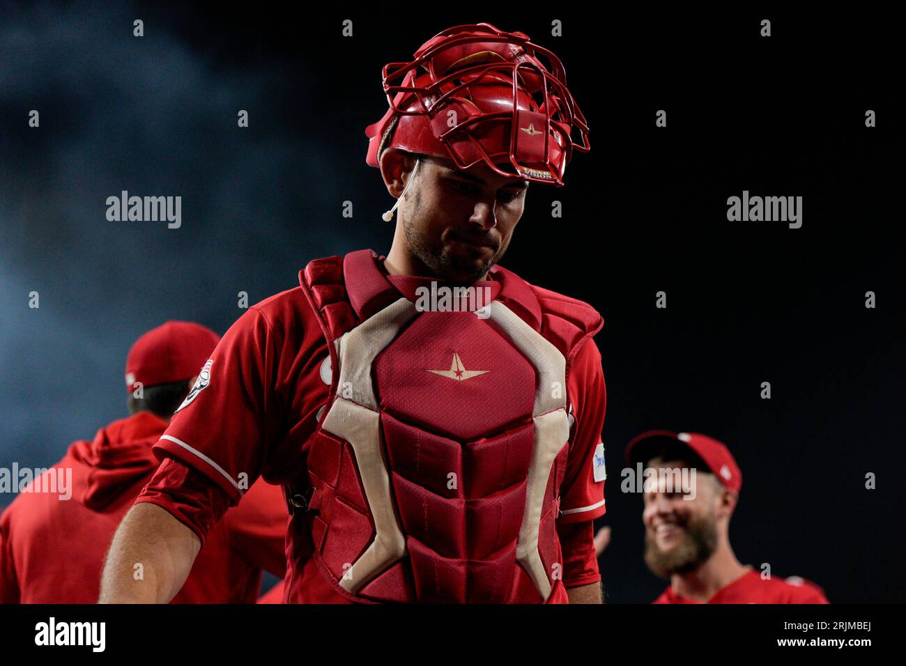 Cincinnati Reds catcher Luke Maile walks into the dugout following a ...