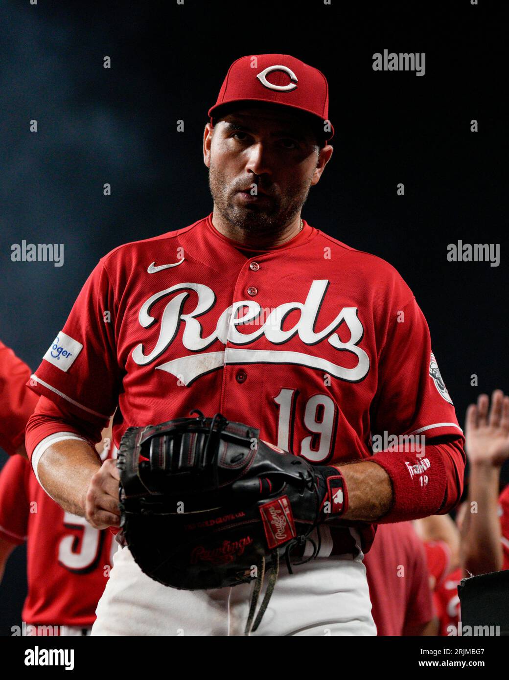 Cincinnati Reds first baseman Joey Votto (19) walks into the dugout ...