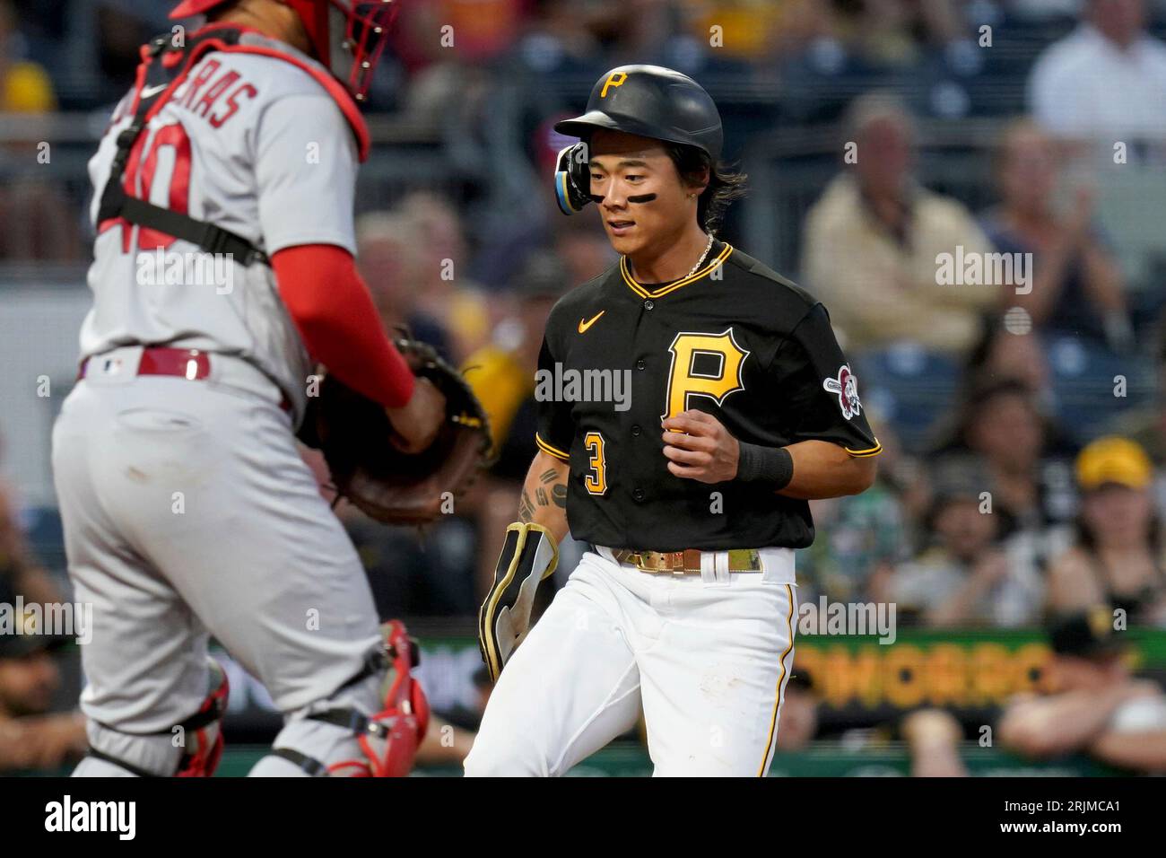 Pittsburgh Pirates' Ji Hwan Bae scores on a base hit by Connor Joe ...