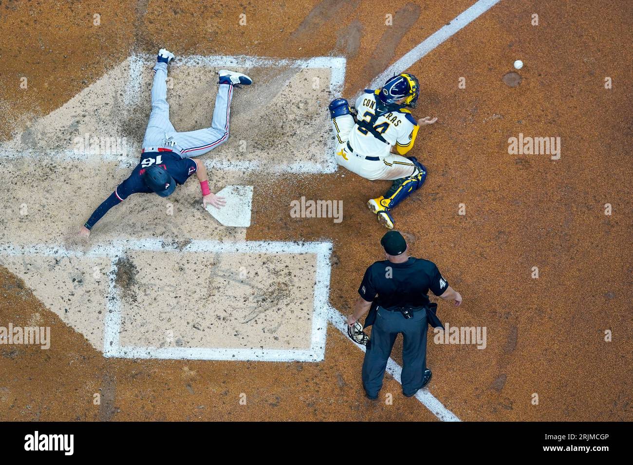Minnesota Twins' Jordan Luplow scores safely past Milwaukee Brewers ...