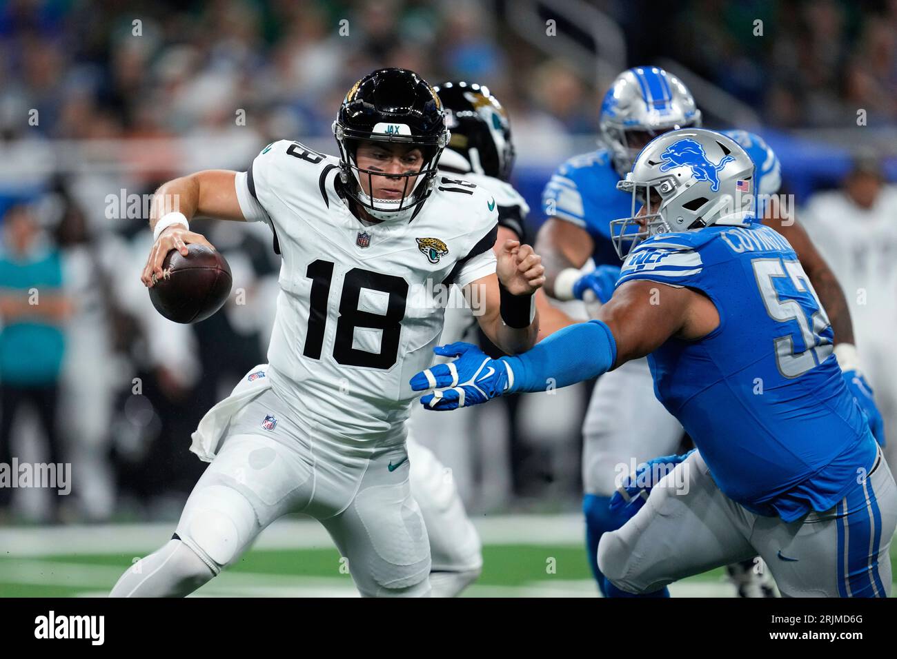 Jacksonville Jaguars quarterback Nathan Rourke (18) tries to evade ...