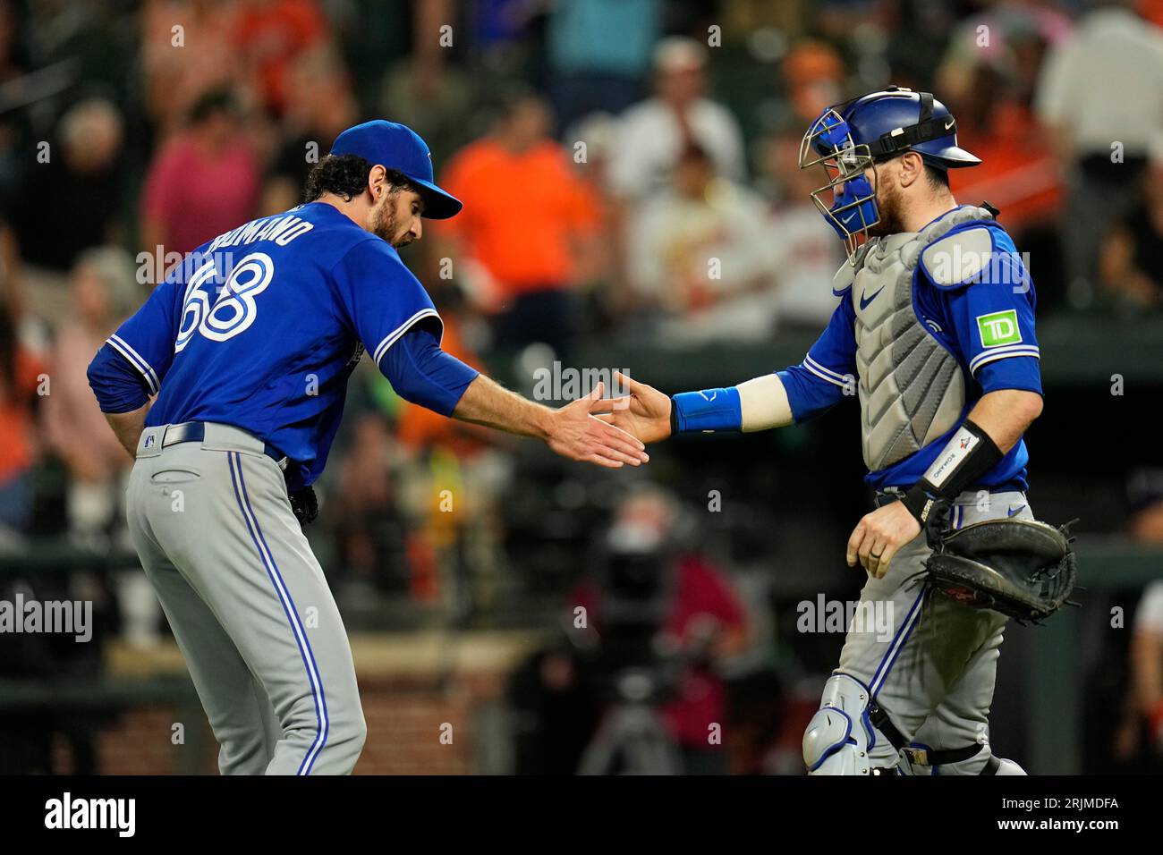 Toronto Blue Jays relief pitcher Jordan Romano, left, and catcher Danny ...