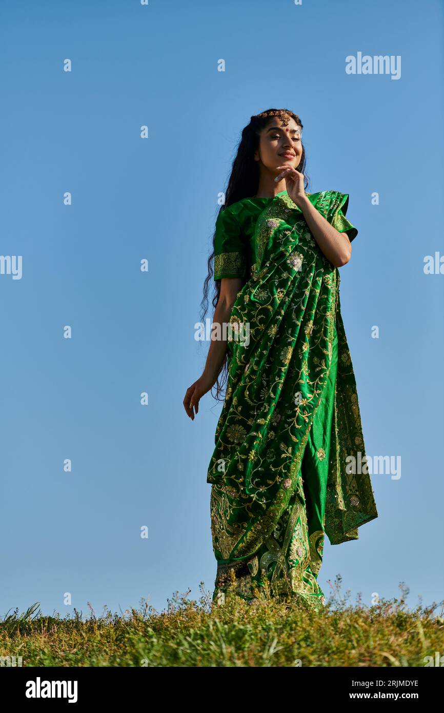 Elegant woman in traditional green hi-res stock photography and images ...