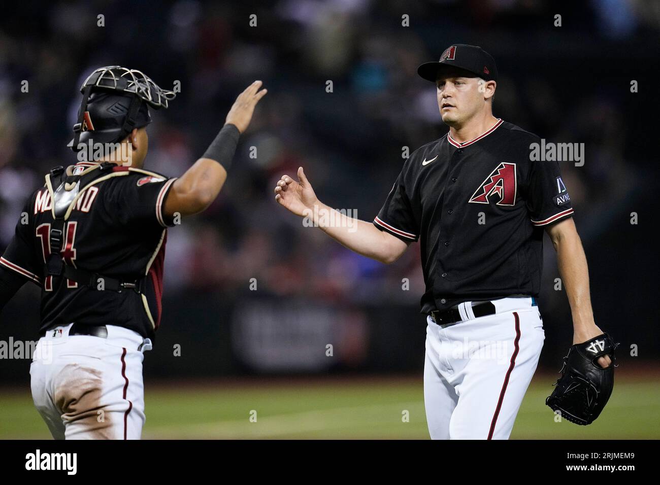 Arizona Diamondbacks relief pitcher Paul Sewald, right, celebrates a ...