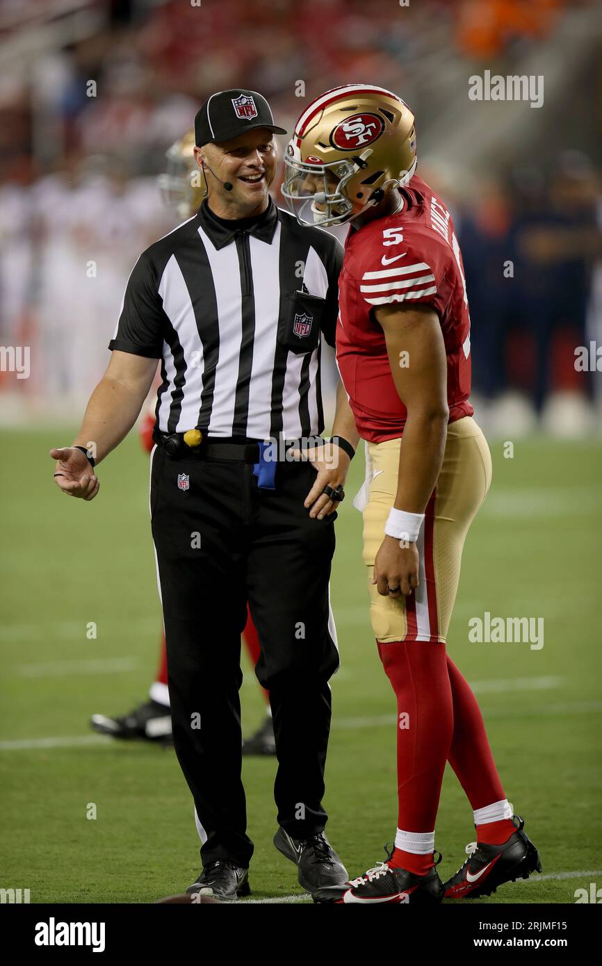 San Francisco 49ers quarterback Trey Lance (5) and Umpire Mike Morton ...