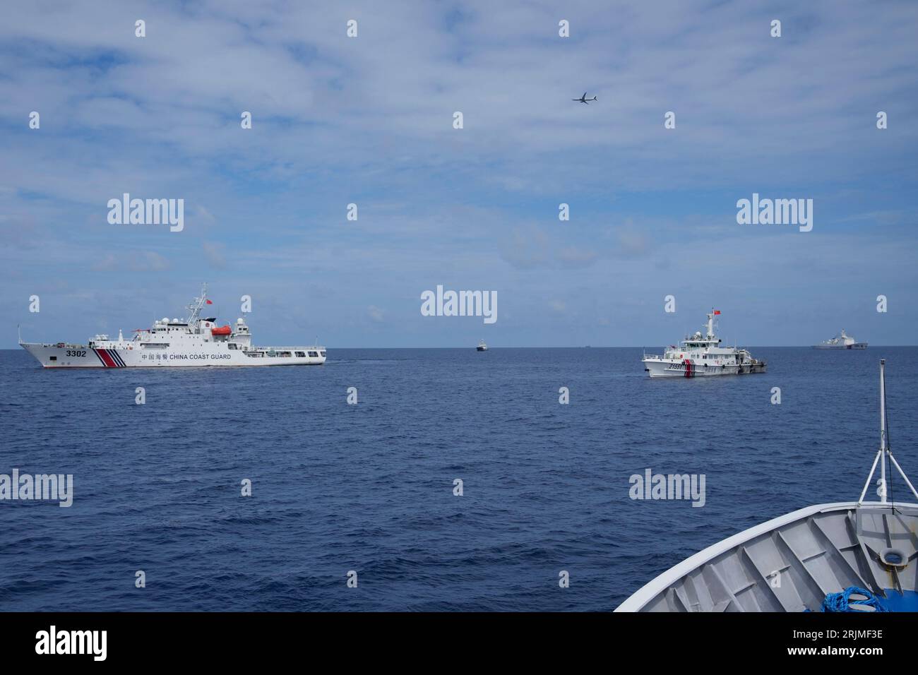 A U.S. Navy plane flies over the areas of Second Thomas Shoal, locally ...
