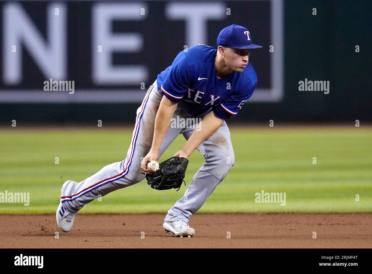 Texas Rangers shortstop Corey Seager flips the ball to second base ...