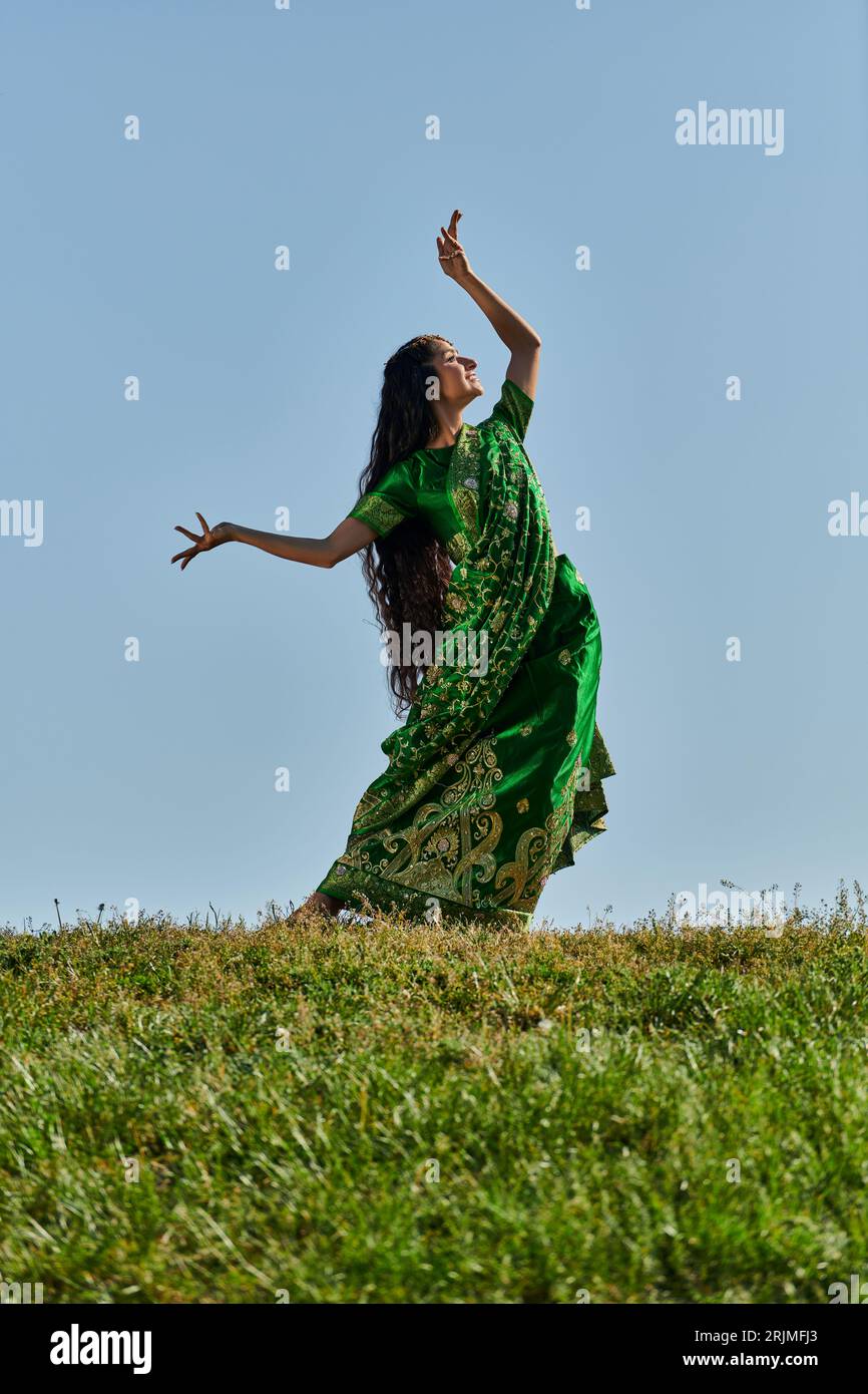 Happy woman dancing in field hi-res stock photography and images - Alamy