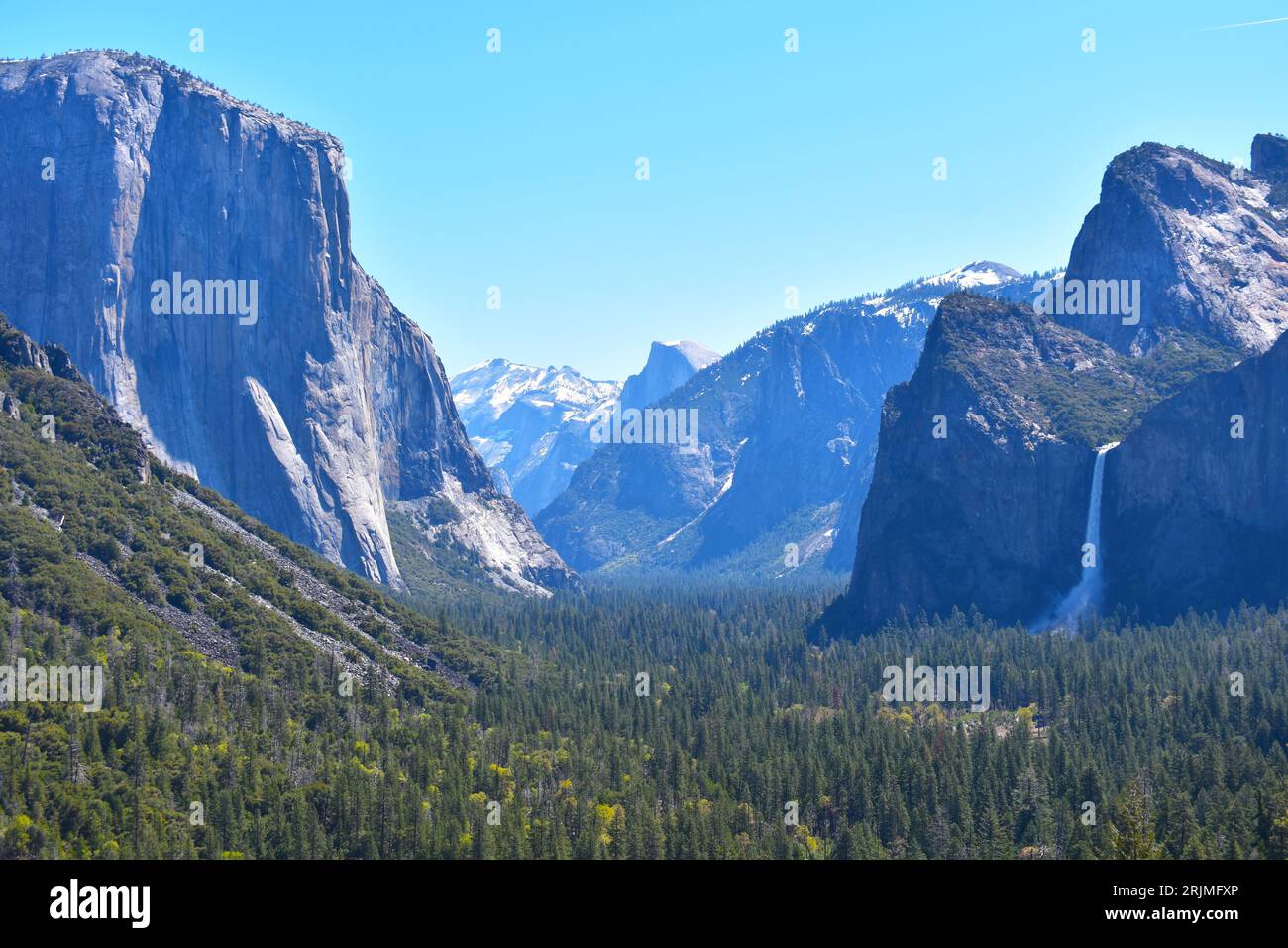 This image features a stunning natural landscape of tall, snow-capped ...