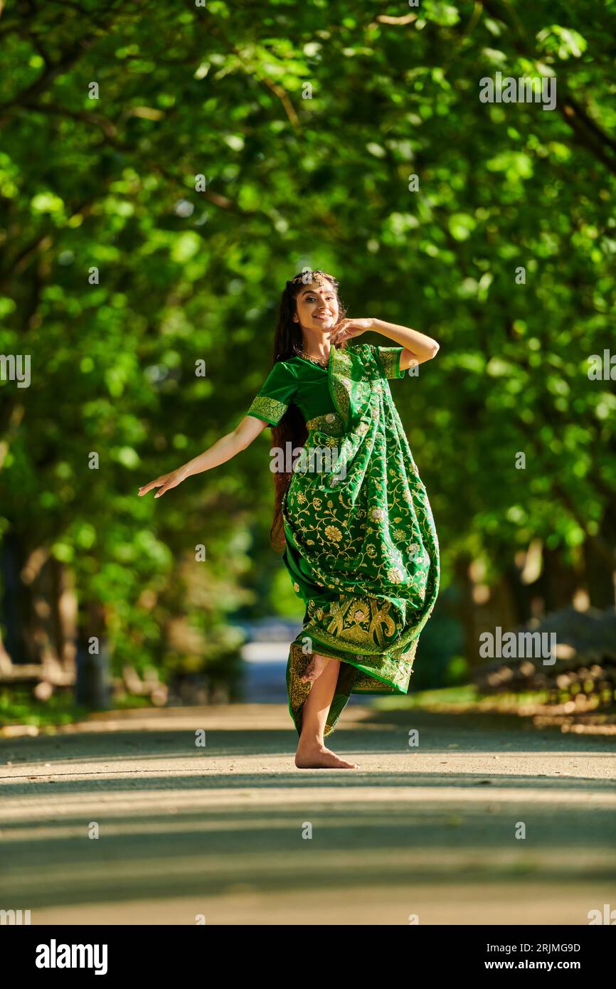 Woman in sari dancing hi-res stock photography and images - Alamy