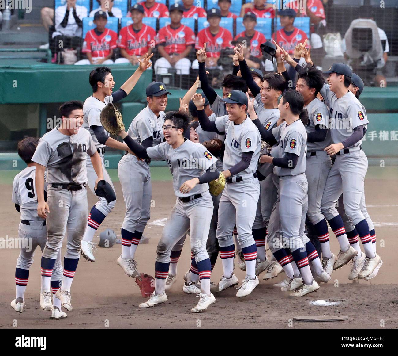 Members of Keio Senior High School Baseball Club react after winning ...