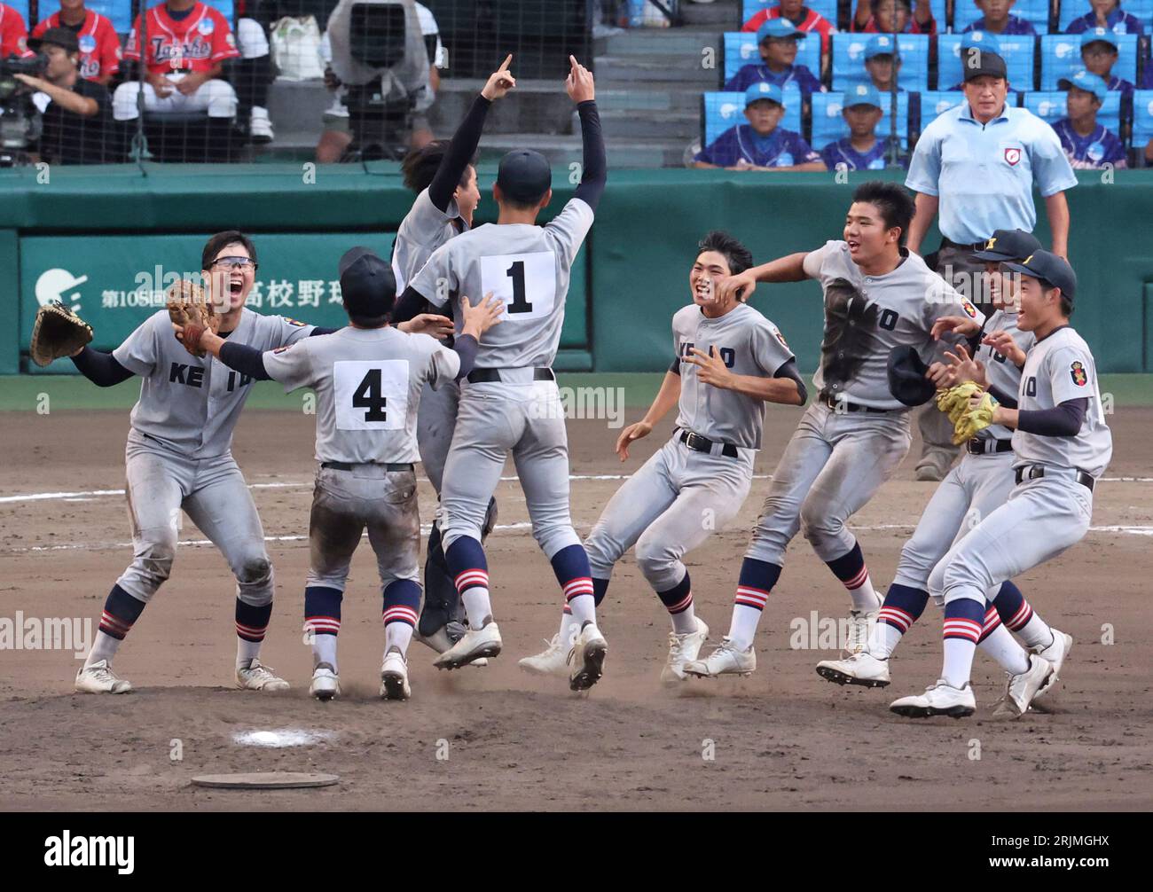 Members of Keio Senior High School Baseball Club react after winning ...