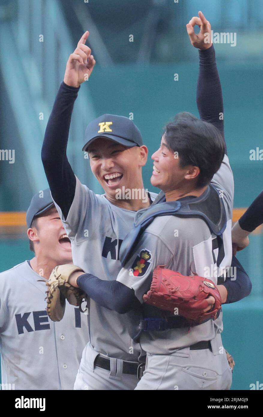 Members of Keio Senior High School Baseball Club react after winning ...