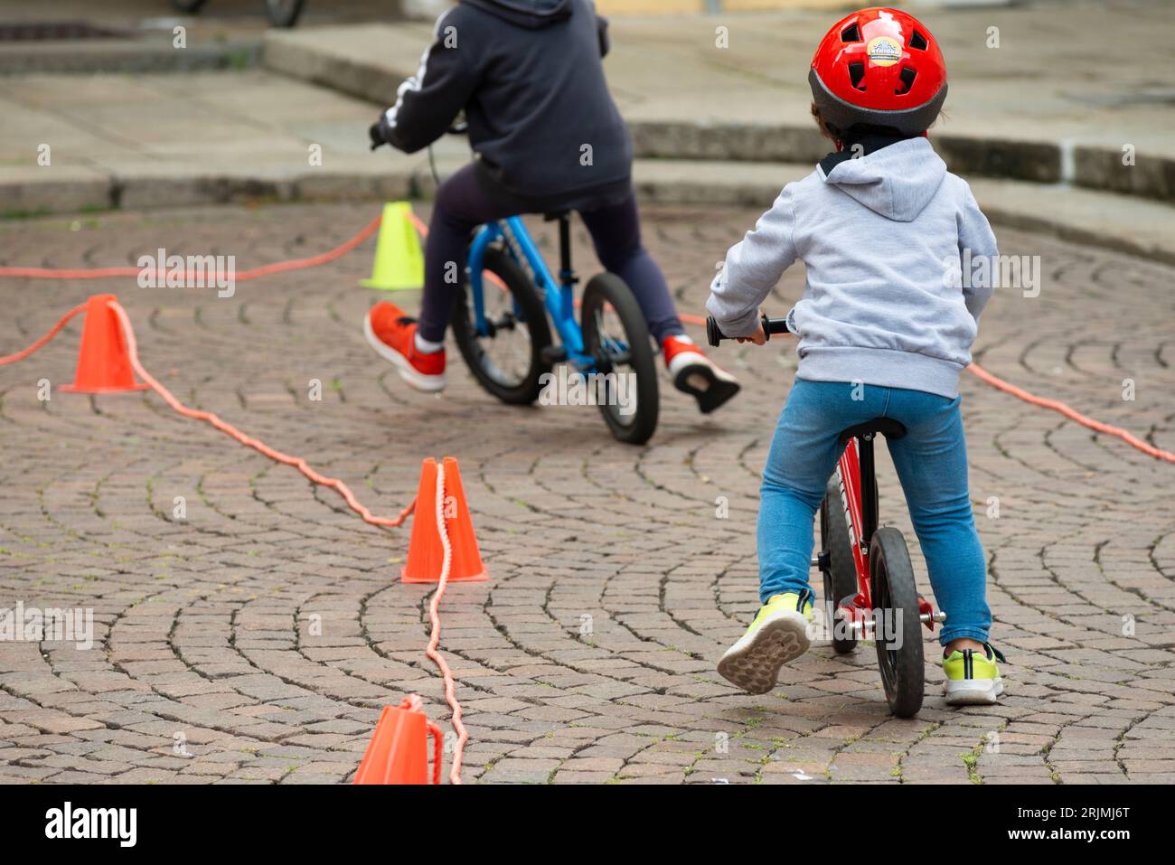 Baby Boy on Balance Bike with Cones as Track Stock Photo - Alamy