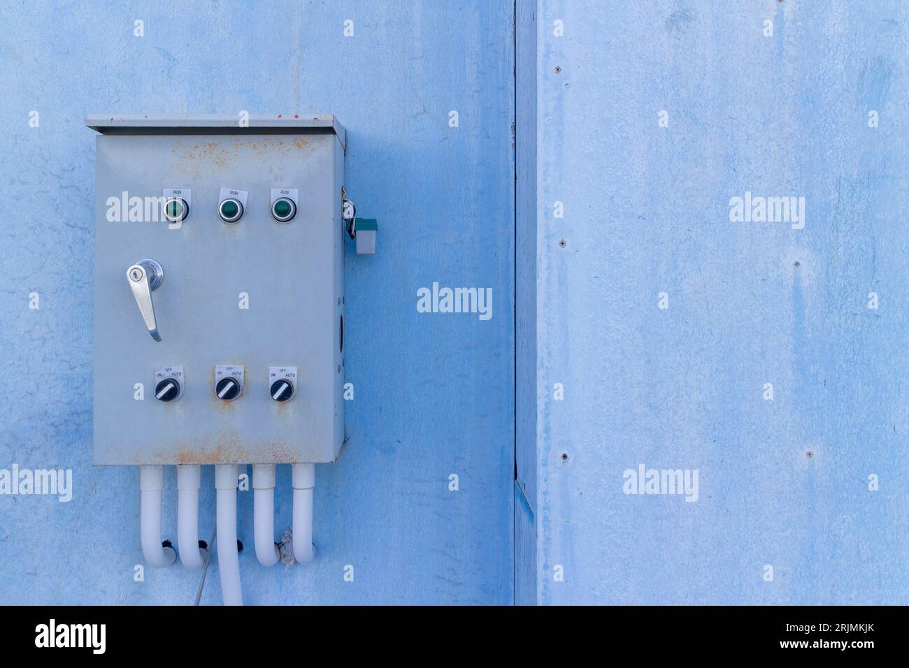 A close-up shot of an electrical panel, showcasing its various switches ...