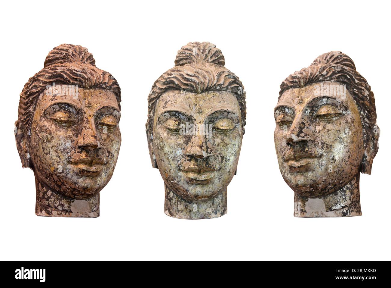 Three wooden Buddha sculptures of heads on a white background Stock ...
