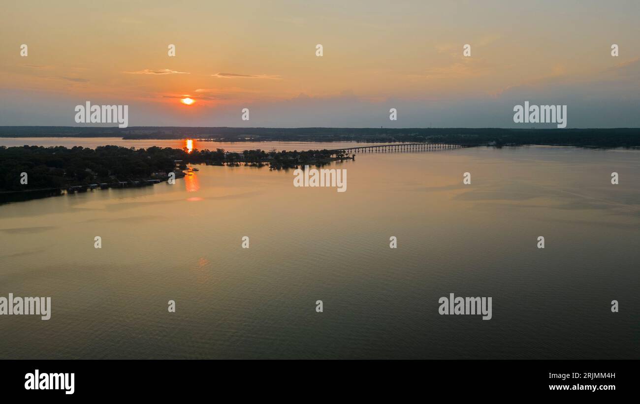 An aerial view of a sailboat bridge on Grand Lake Oklahoma, illuminated ...