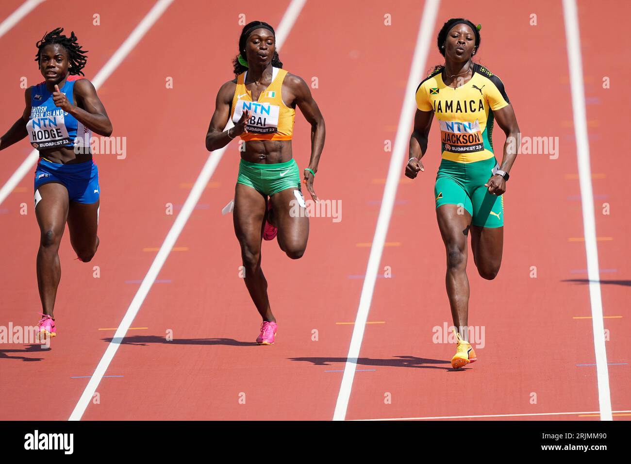 Shericka Jackson, of Jamaica, right, competes with Jessika Gbai, of The ...