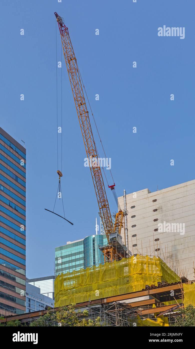Lifting Crane at Top of Skyscraper Construction Site in Hong Kong Stock ...