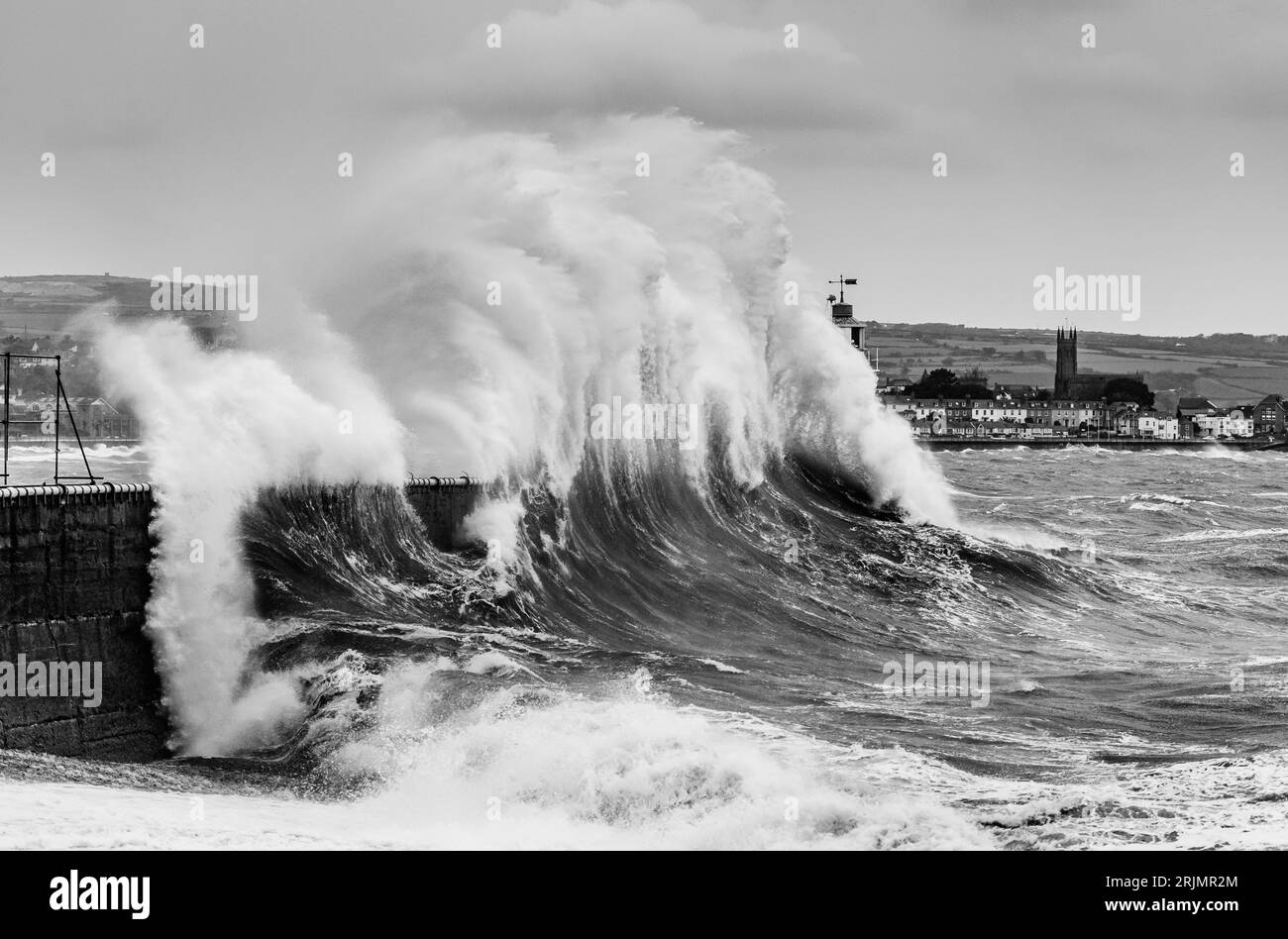 Huge waves crash into Newlyn harbour some reaching as high and above ...