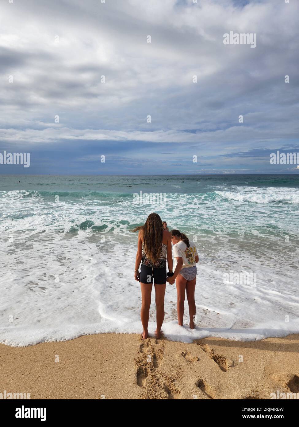 A cheerful mother and daughter enjoying a sunny day at the beach in Hawaii Stock Photo - Alamy