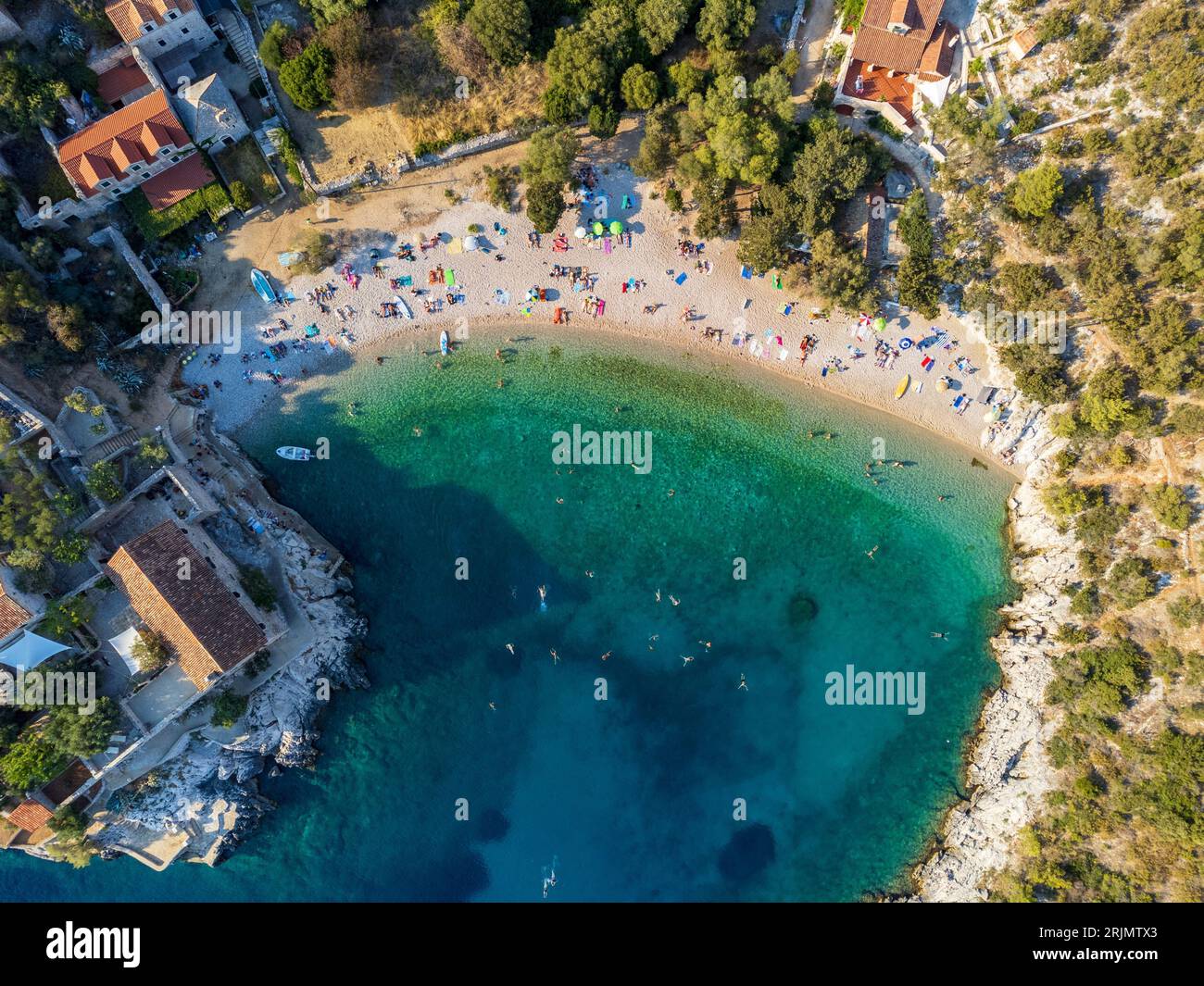 Aerial view of Dubovica beach on Hvar island in Croatia. Tourists sunbathing on amazing beach in ...
