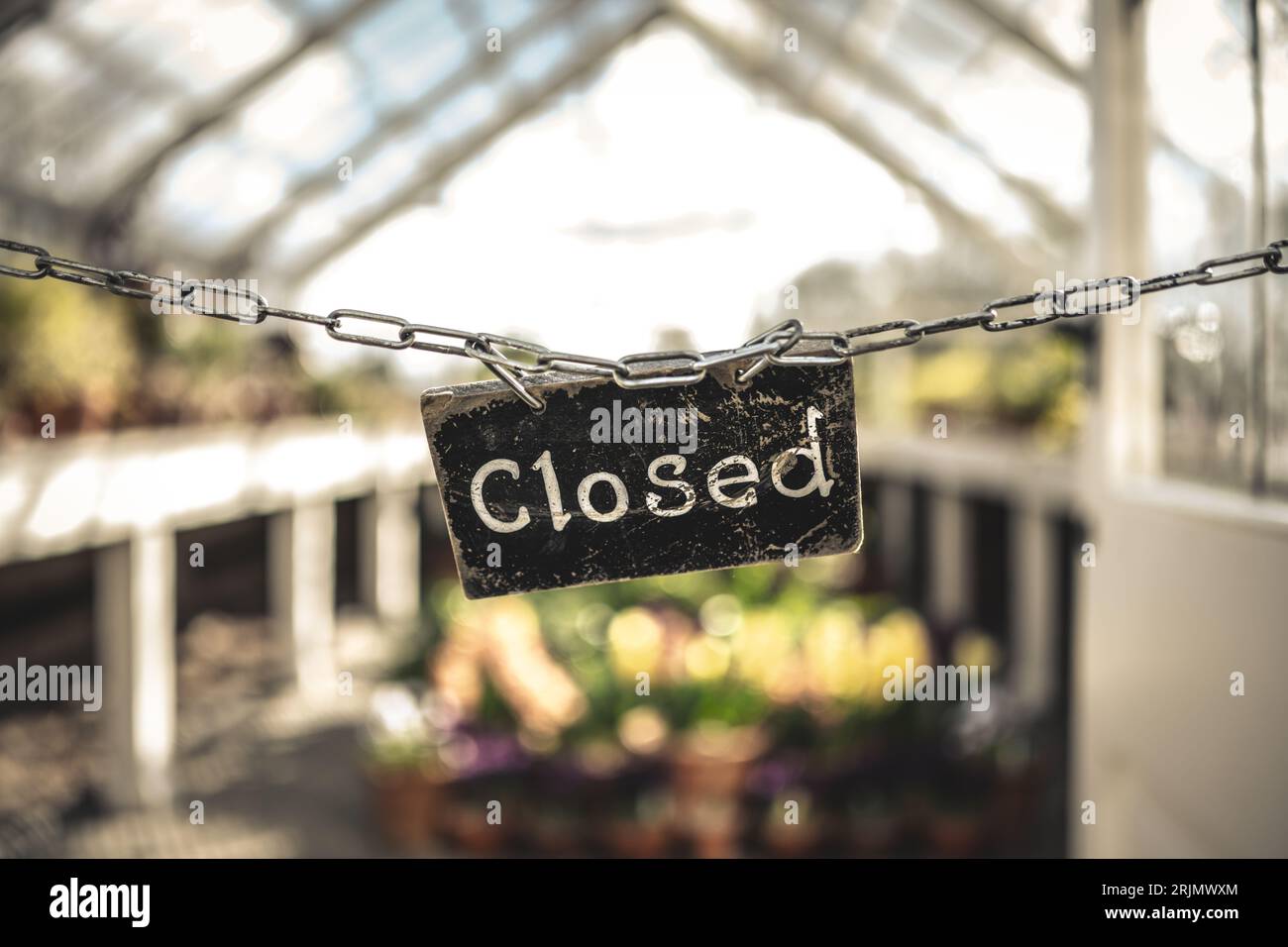An old closed sign hanging from a metal chain. No entry Stock Photo - Alamy
