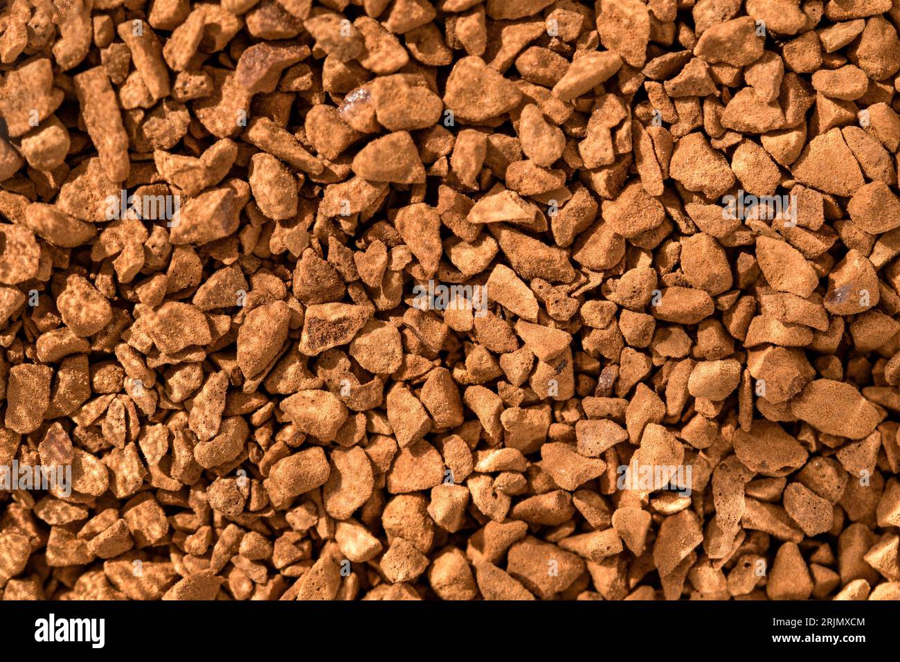 Freeze-dried instant coffee background close-up. Heap of powdered brown ...