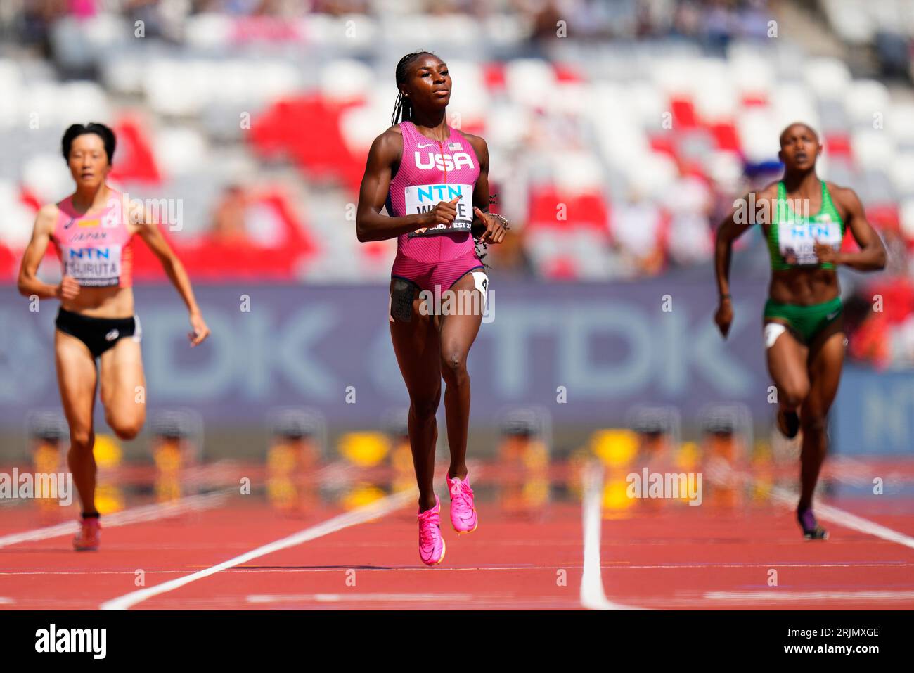 Kayla White, of the United States races in a Women's 200-meters heat ...