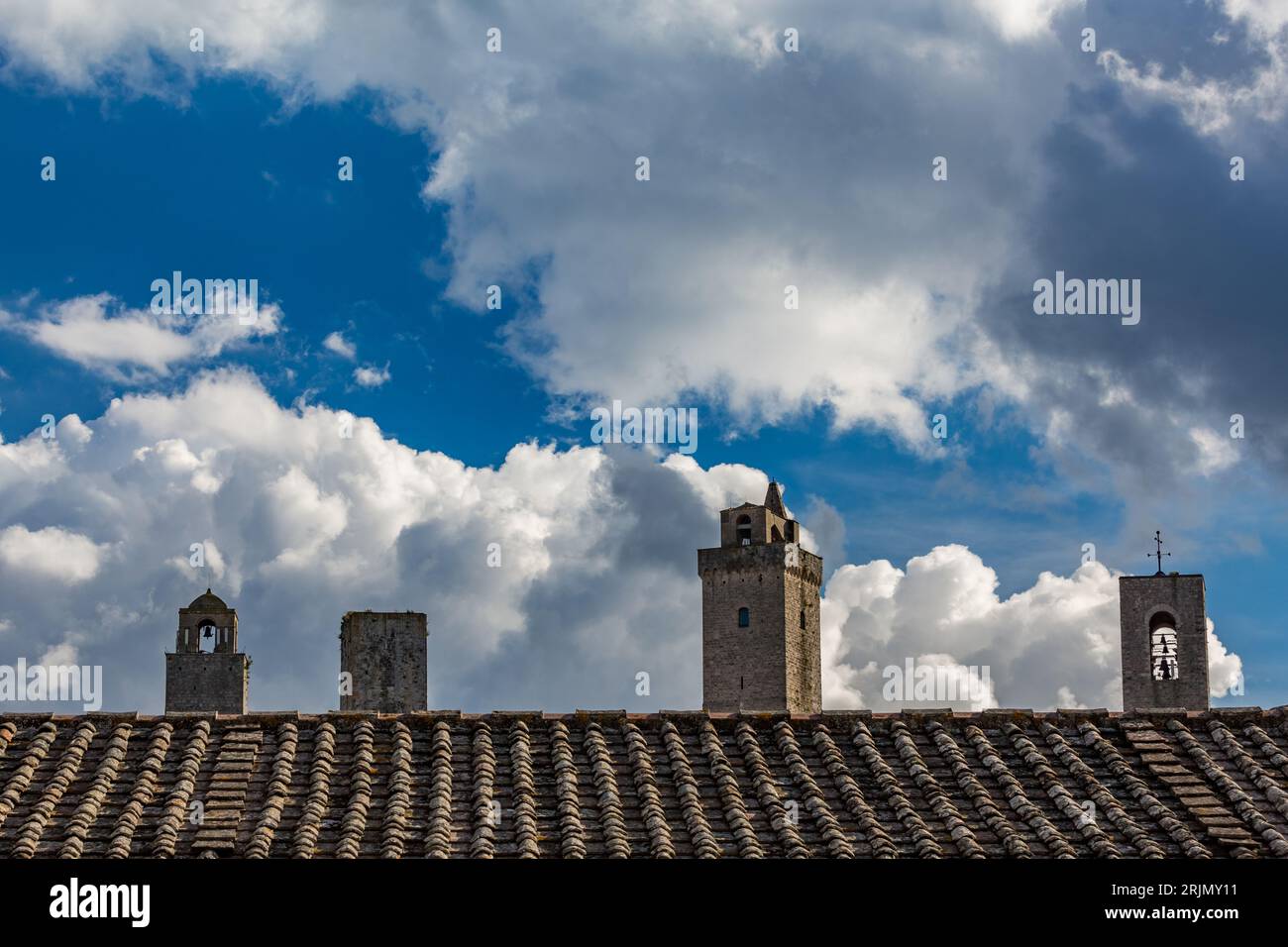 Siena, Tuscany, Italy, tiled roof with partial view of towers and ...