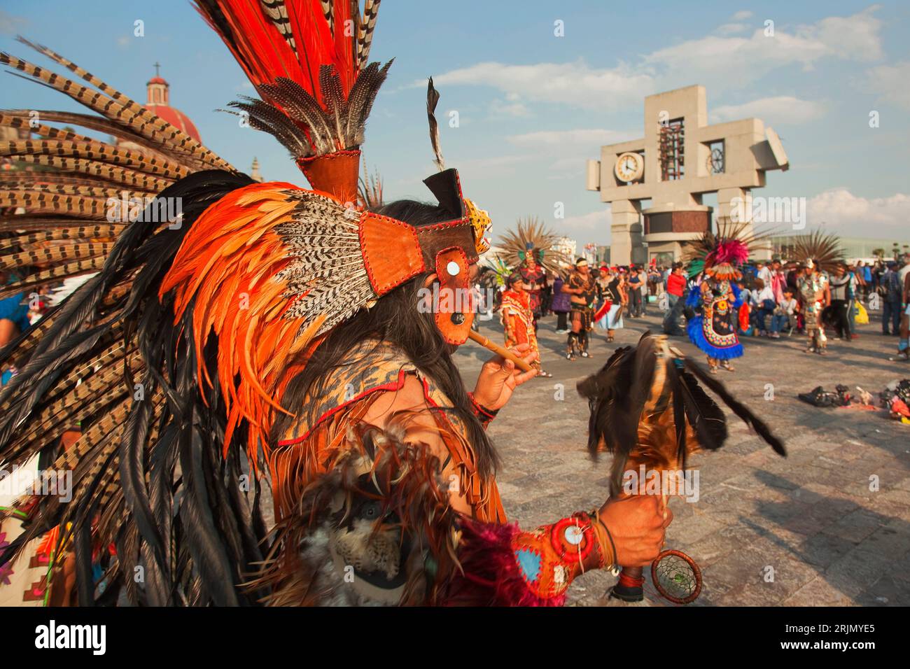 Indigenous people wearing mask and traditional clothing performing ...