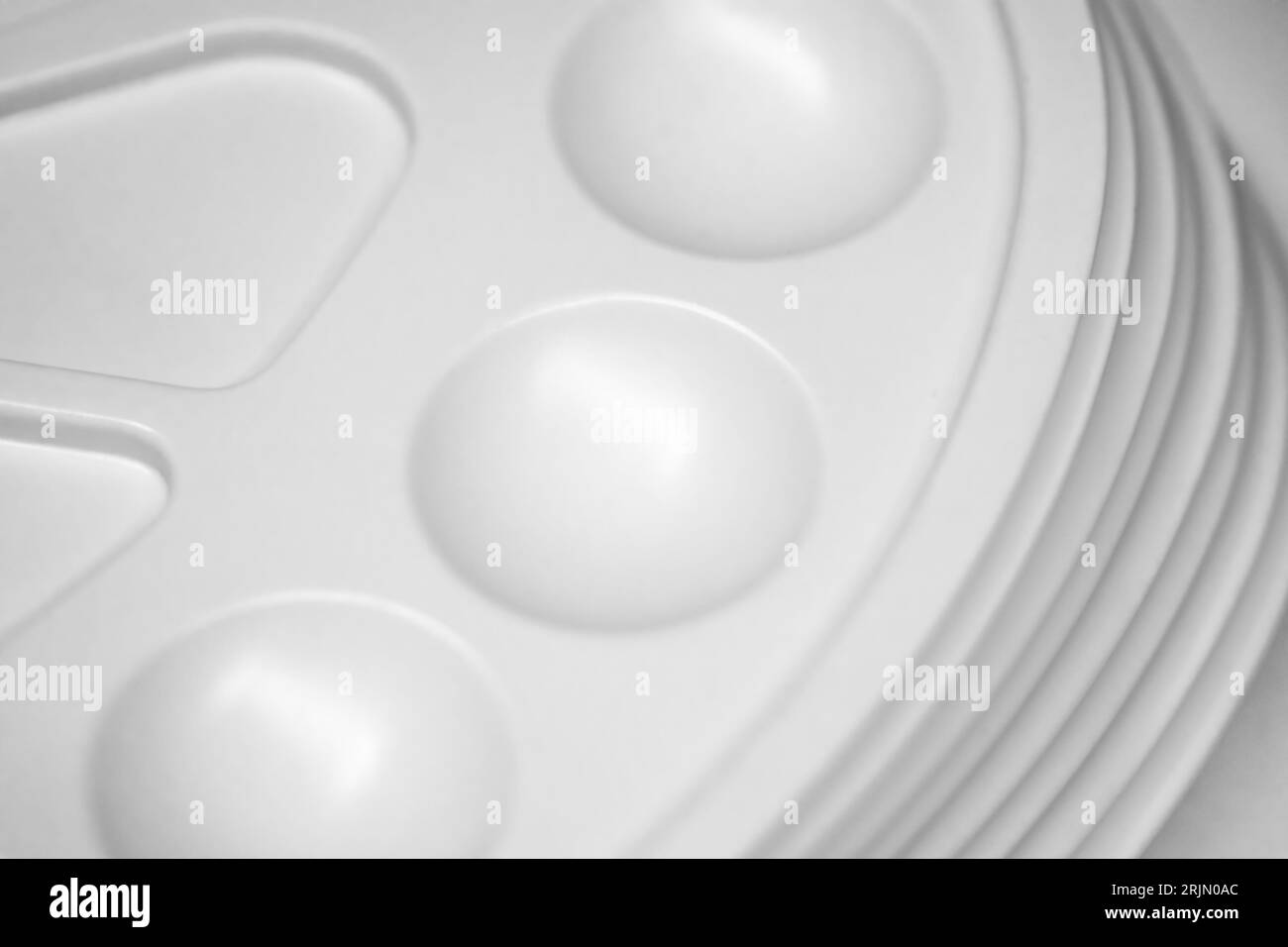 A stack of clean white art palettes. student and education concept ...