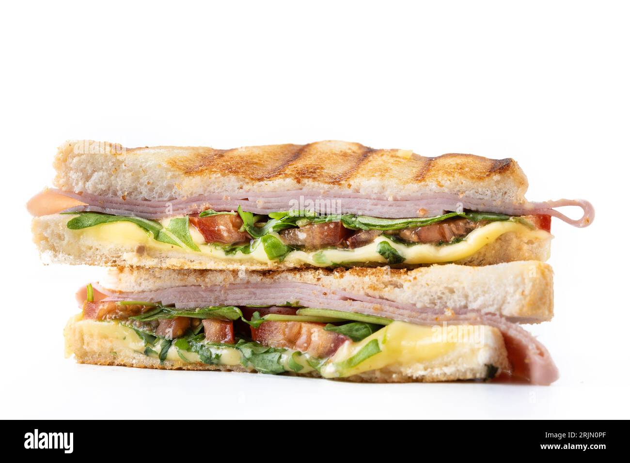 Panini sandwich with ham, cheese, tomato and arugula isolated on white ...