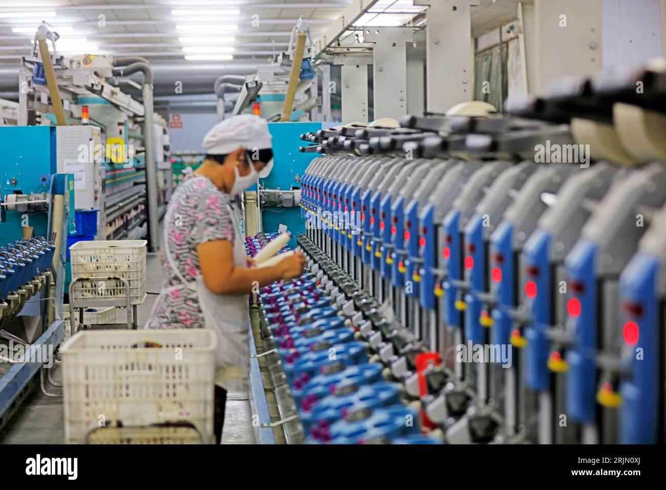 Female spinners on the production line Stock Photo - Alamy