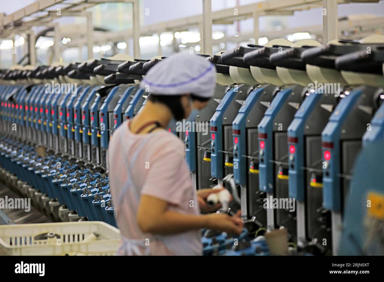 Female spinners on the production line Stock Photo - Alamy