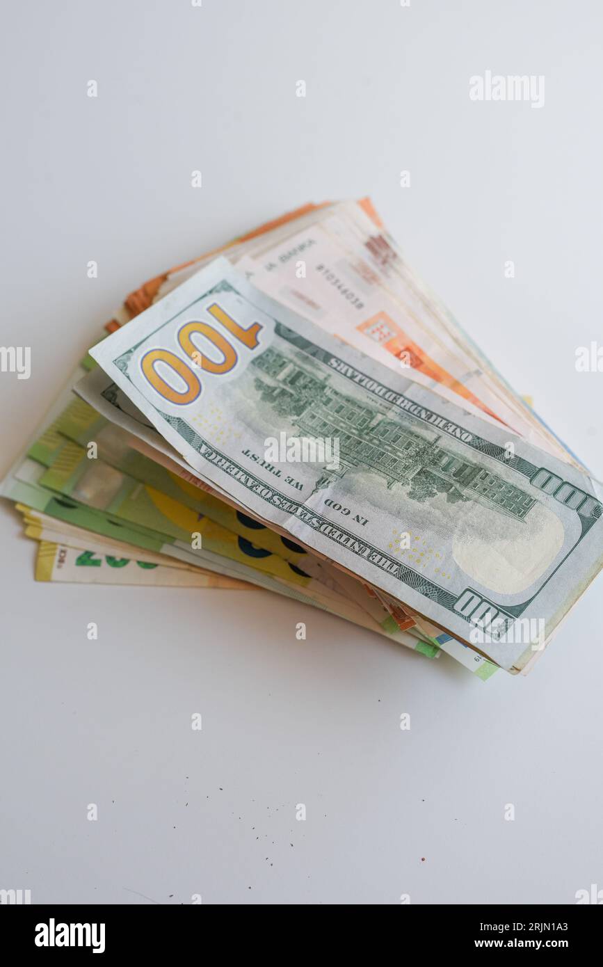 A mound of paper money on a white background, arranged in a stack Stock ...