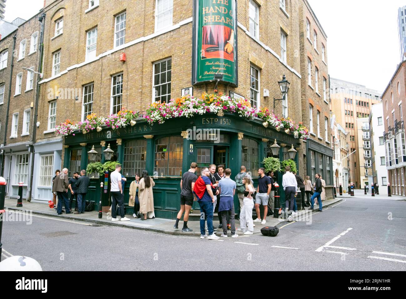 Workers people gathered outside the Hand and Shears pub Cloth Fair ...