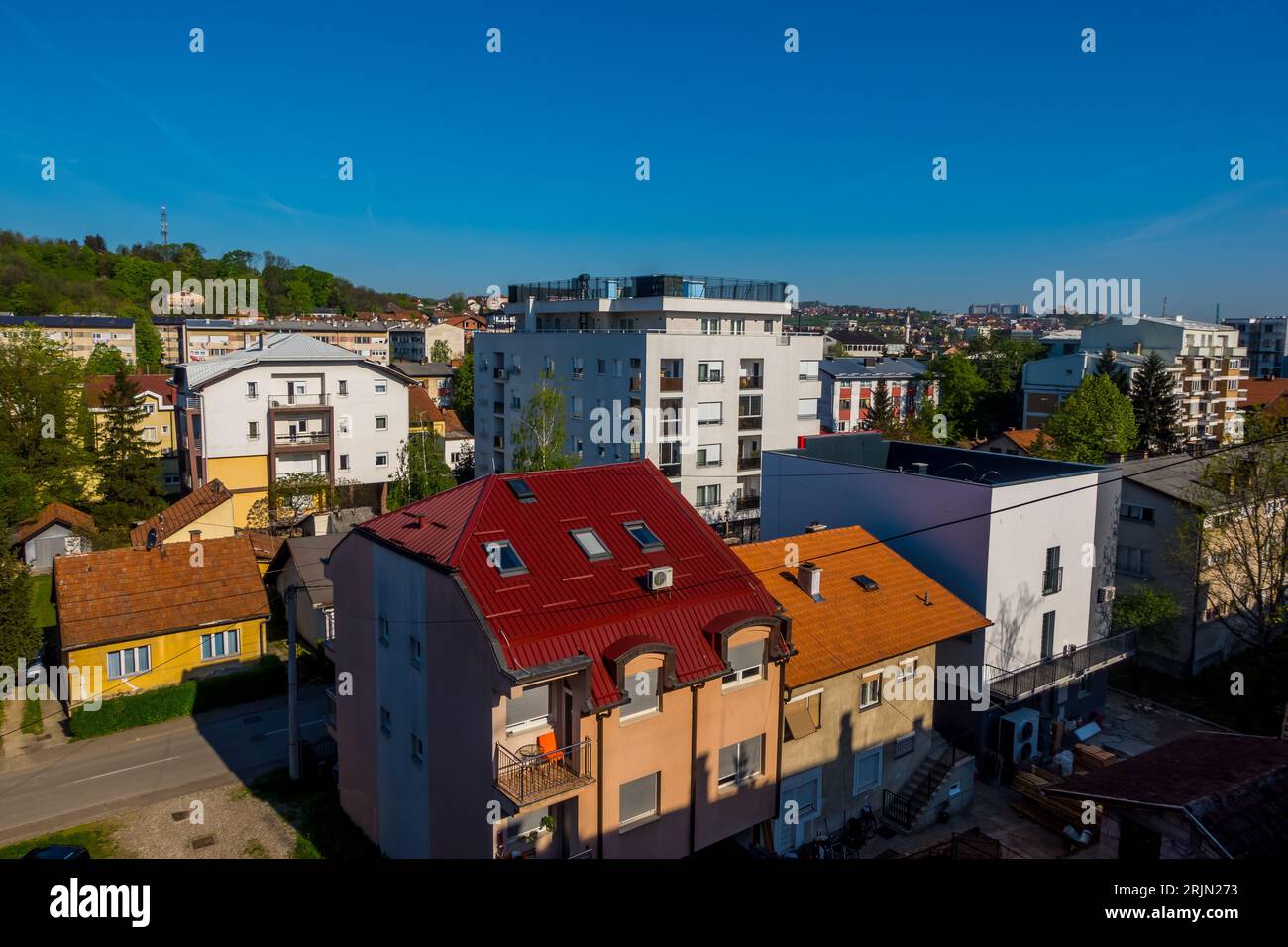 An aerial view of a bustling residential area featuring a multitude of ...