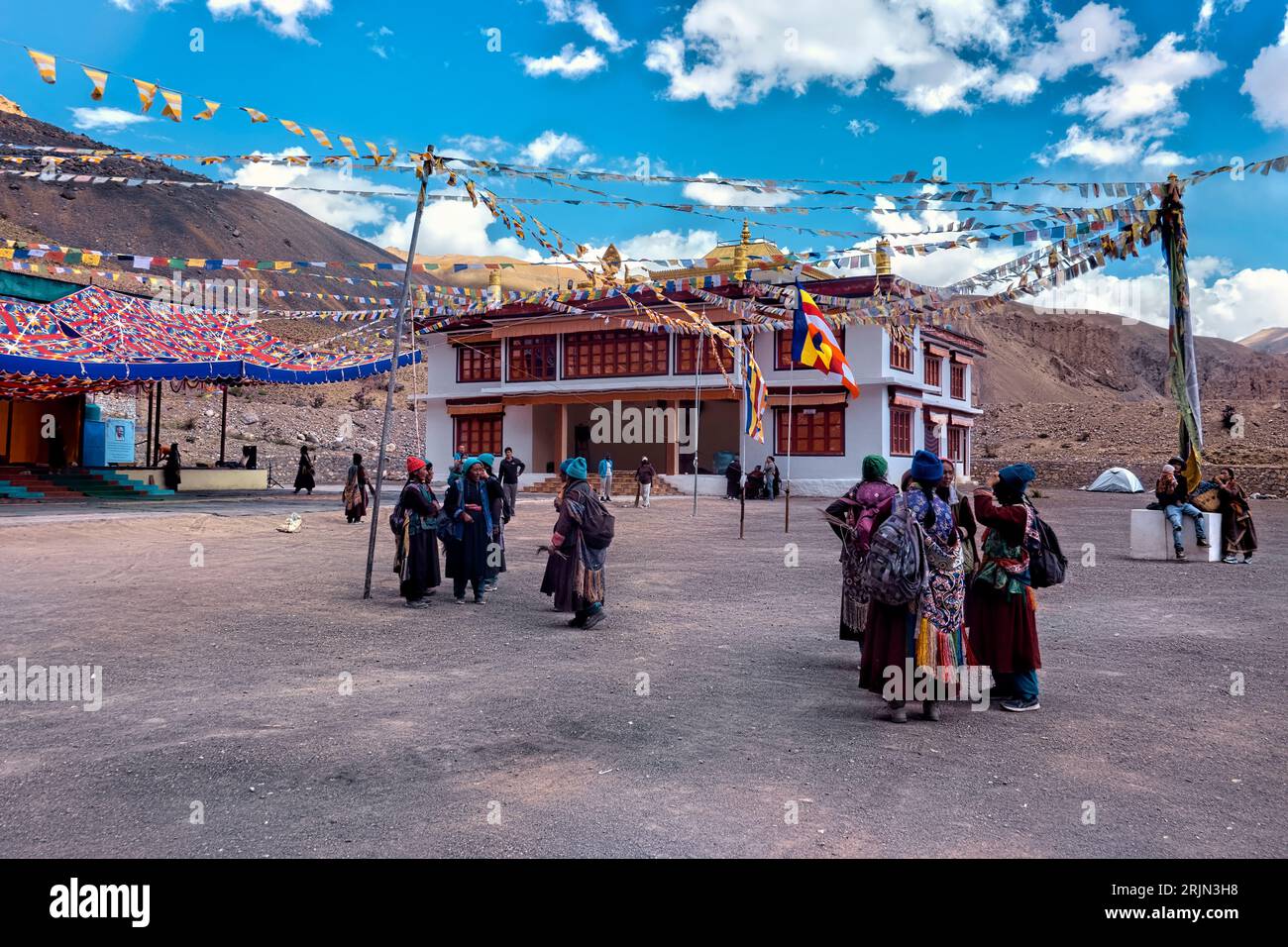 Ladakhi women in traditional clothing (perak headdress) at a high lama ...
