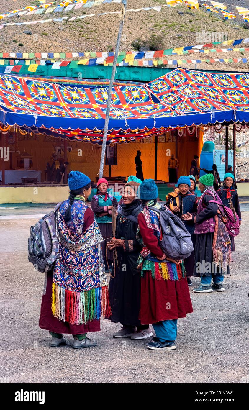 Ladakhi women in traditional clothing (perak headdress) at a high lama ...