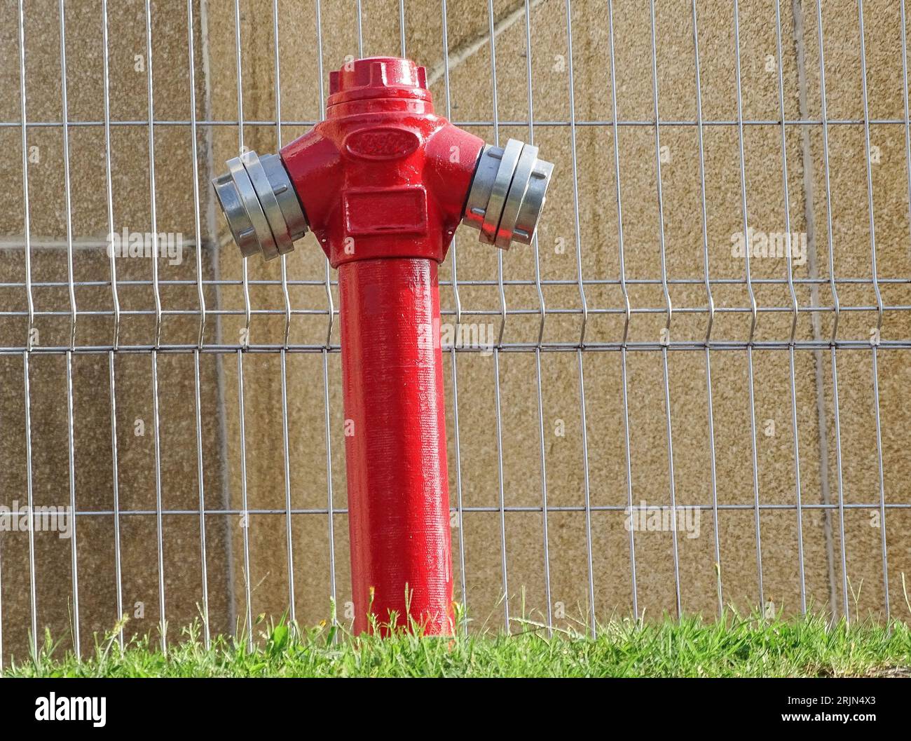Red hydrant in the city. Romania Stock Photo - Alamy
