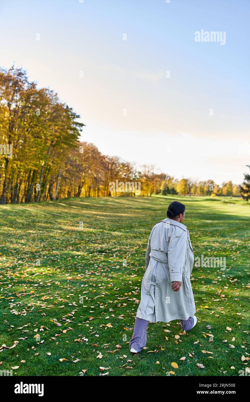 Woman in trench coat back view hi-res stock photography and images - Alamy