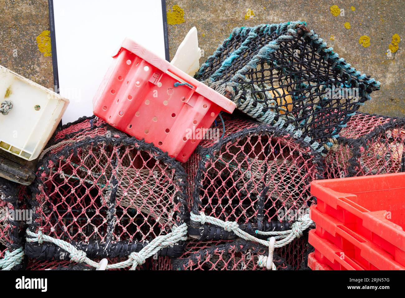 A group of lobster traps and several plastic containers Stock Photo - Alamy