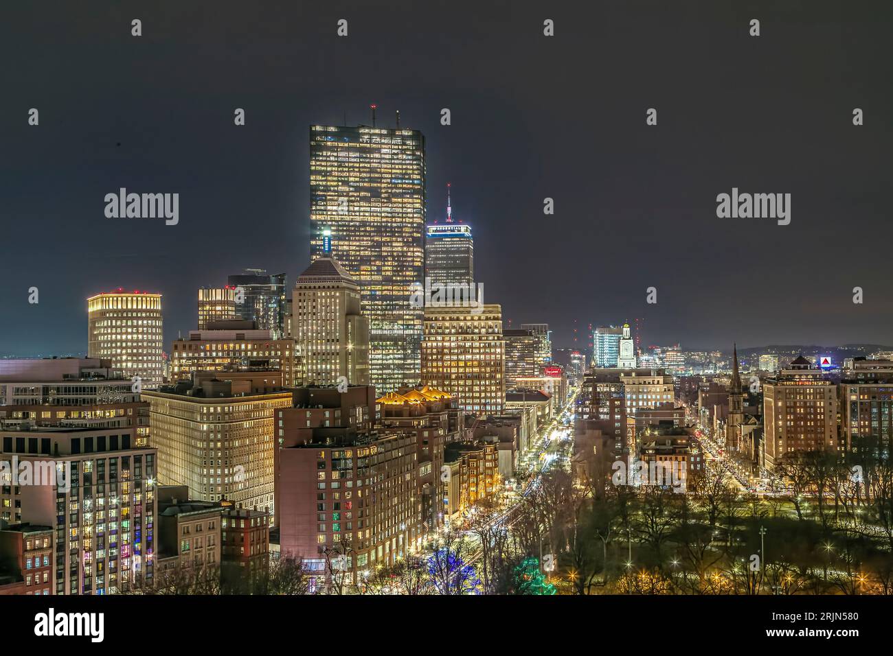 An aerial view of the Boston Back Bay skyline at night with illuminated ...